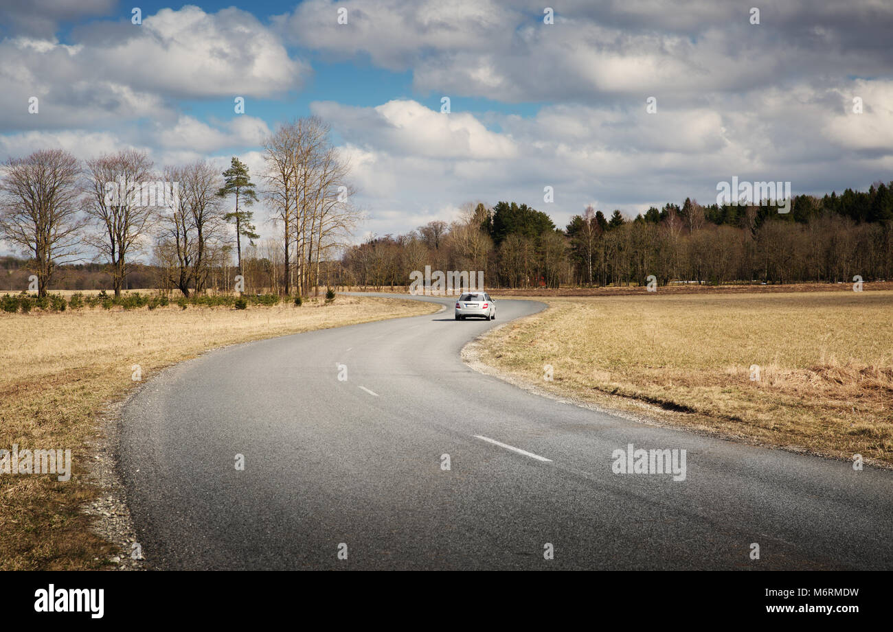 Car on asphalt road in beautiful spring day Stock Photo - Alamy