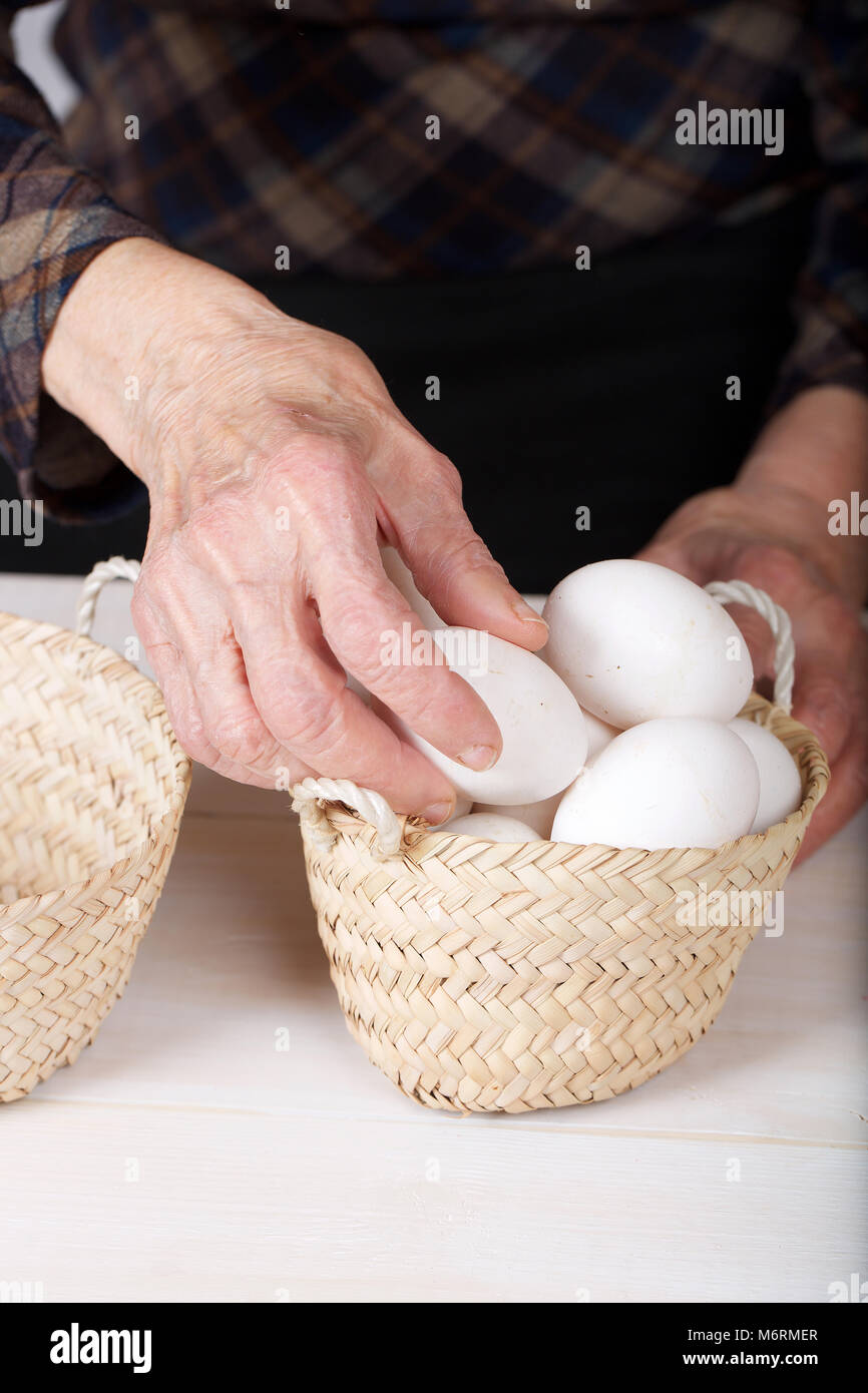 Old woman and fresh chicken eggs.Closeup Stock Photo - Alamy
