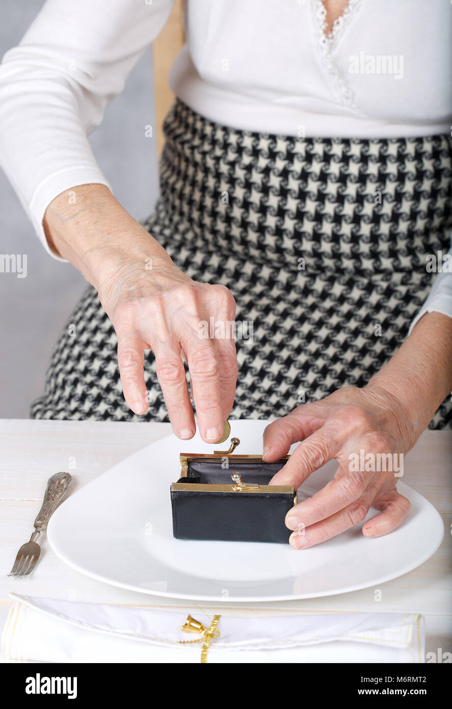 Old woman shows empty hi-res stock photography and images - Alamy