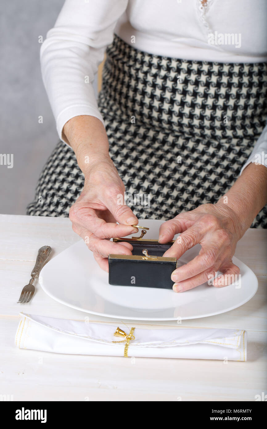 Old woman shows her empty lunch plate Stock Photo - Alamy