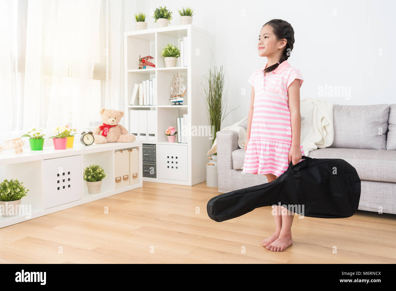 Chinese kids playing musical instrument hi-res stock photography and ...