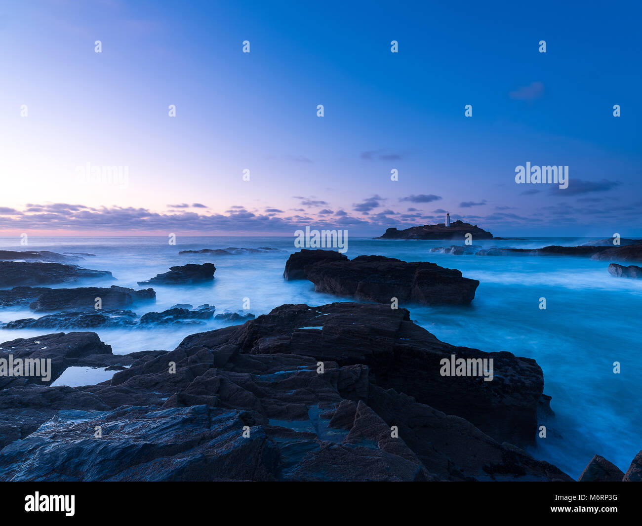 Godrevy beach rocks and Lighthouse Cornwall Stock Photo - Alamy