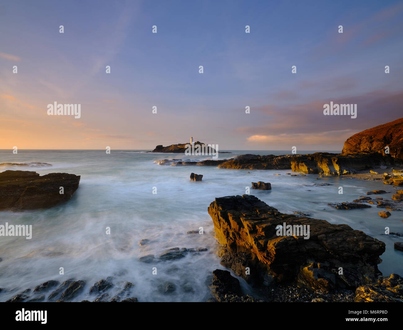 Godrevy beach rocks and Lighthouse Cornwall Stock Photo - Alamy