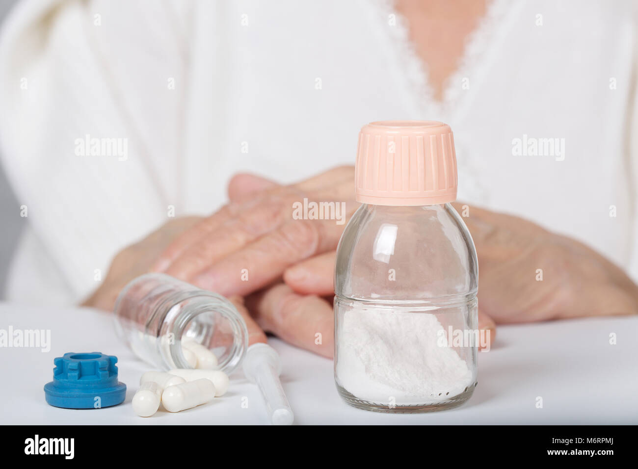 Antibiotics in powder in front of a senior woman Stock Photo - Alamy