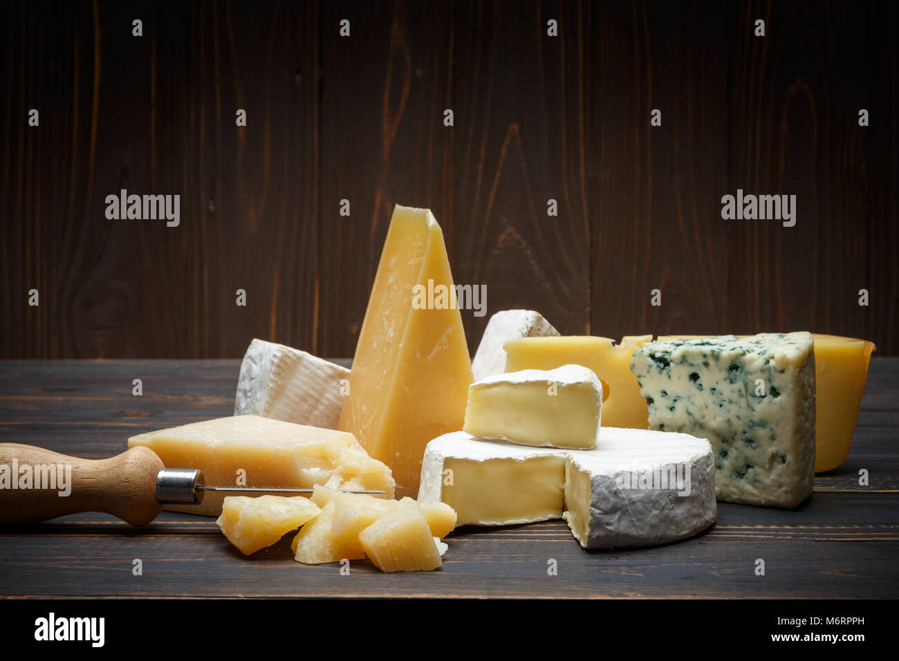 Various types of cheese - parmesan, brie, roquefort, cheddar Stock ...