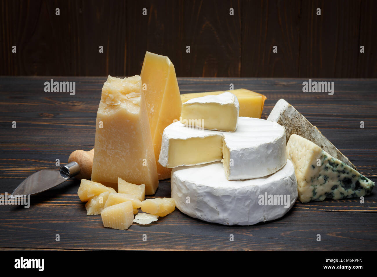 Various types of cheese - parmesan, brie, roquefort, cheddar Stock ...
