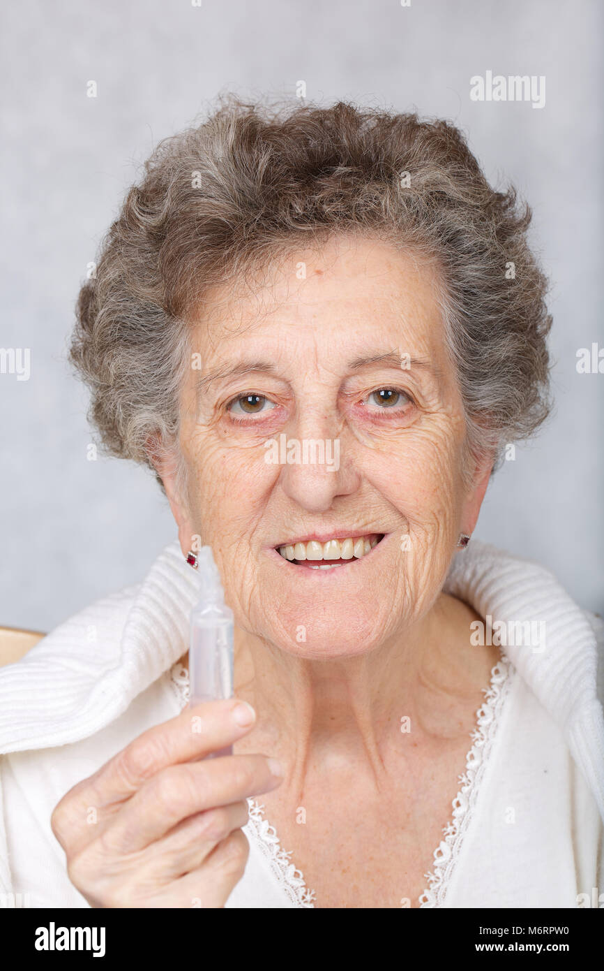 Old woman keeps eye drops.Closeup Stock Photo - Alamy