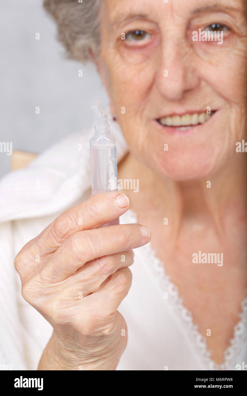 Old woman keeps eye drops.Closeup Stock Photo - Alamy
