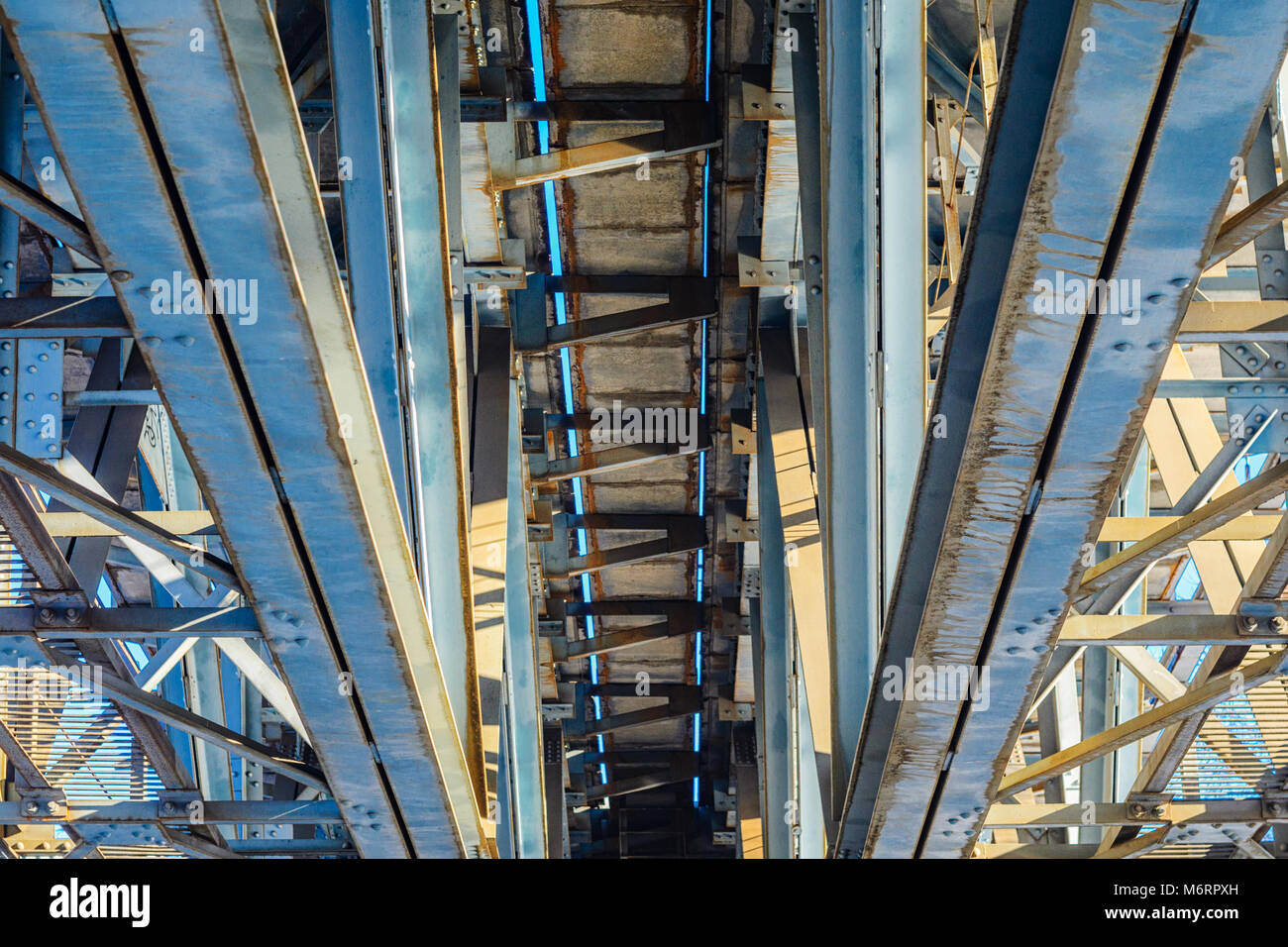The structural elements of the railway steel bridge. Industrial ...