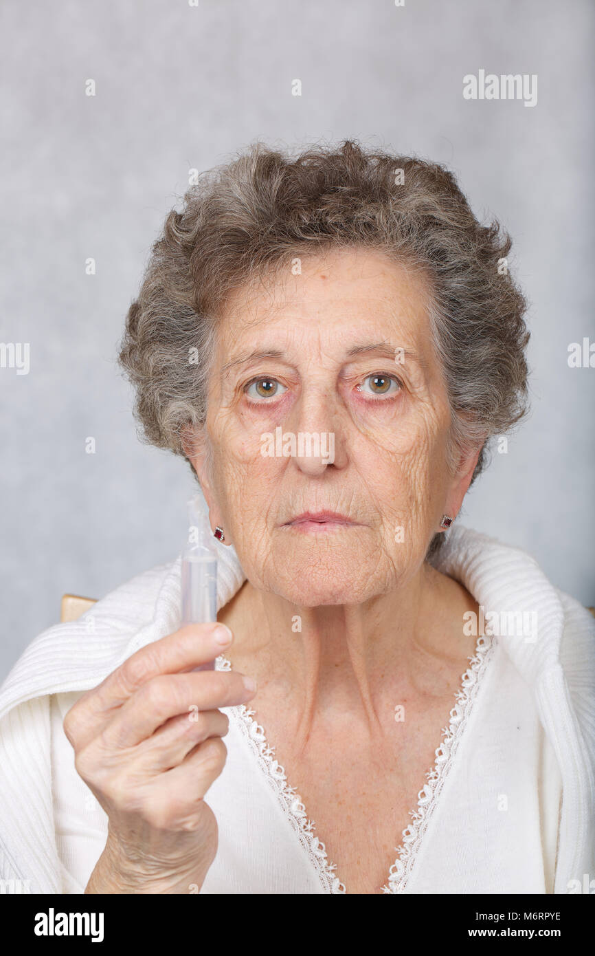 Old woman keeps eye drops.Closeup Stock Photo - Alamy