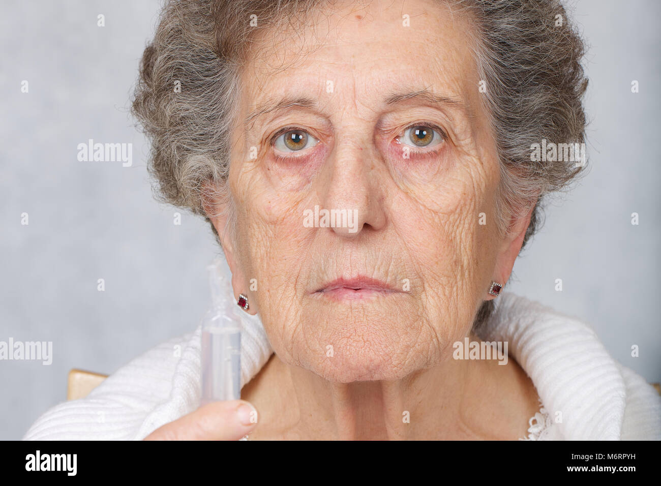 Old woman keeps eye drops.Closeup Stock Photo - Alamy