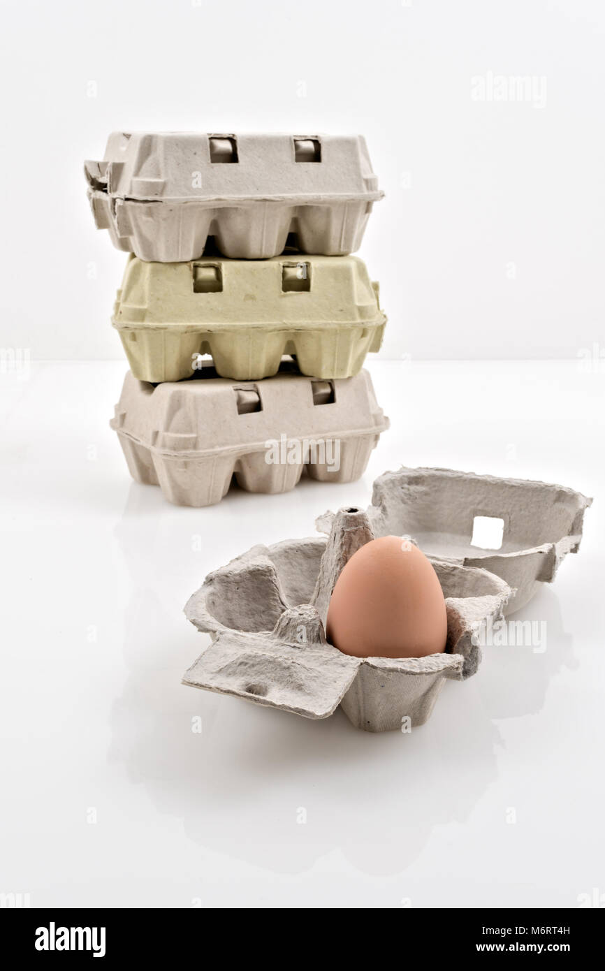empty egg box with egg on white 3 Stock Photo - Alamy