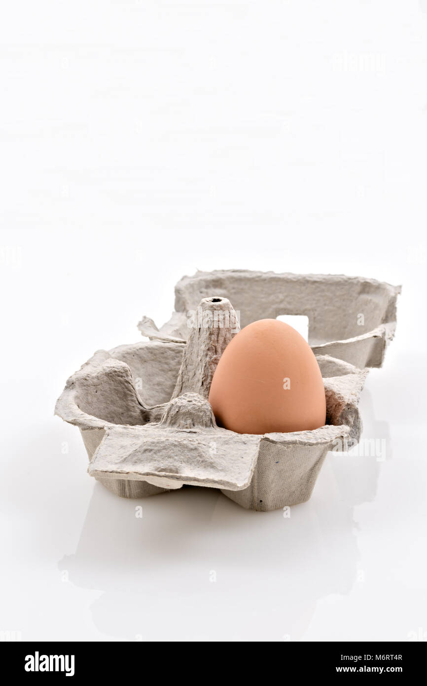 empty egg box with egg on white 5 Stock Photo - Alamy