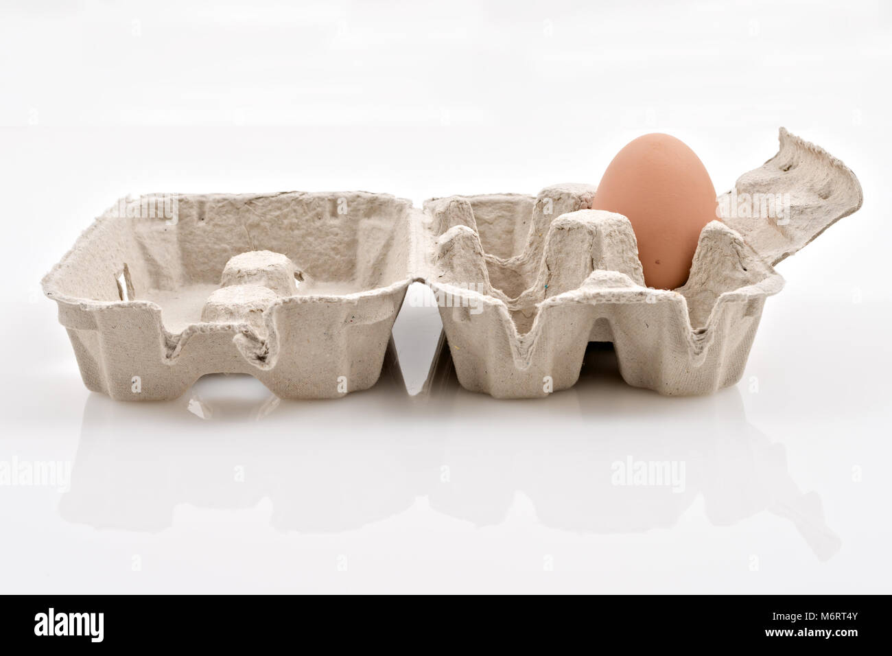 empty egg box with egg on white 6 Stock Photo - Alamy