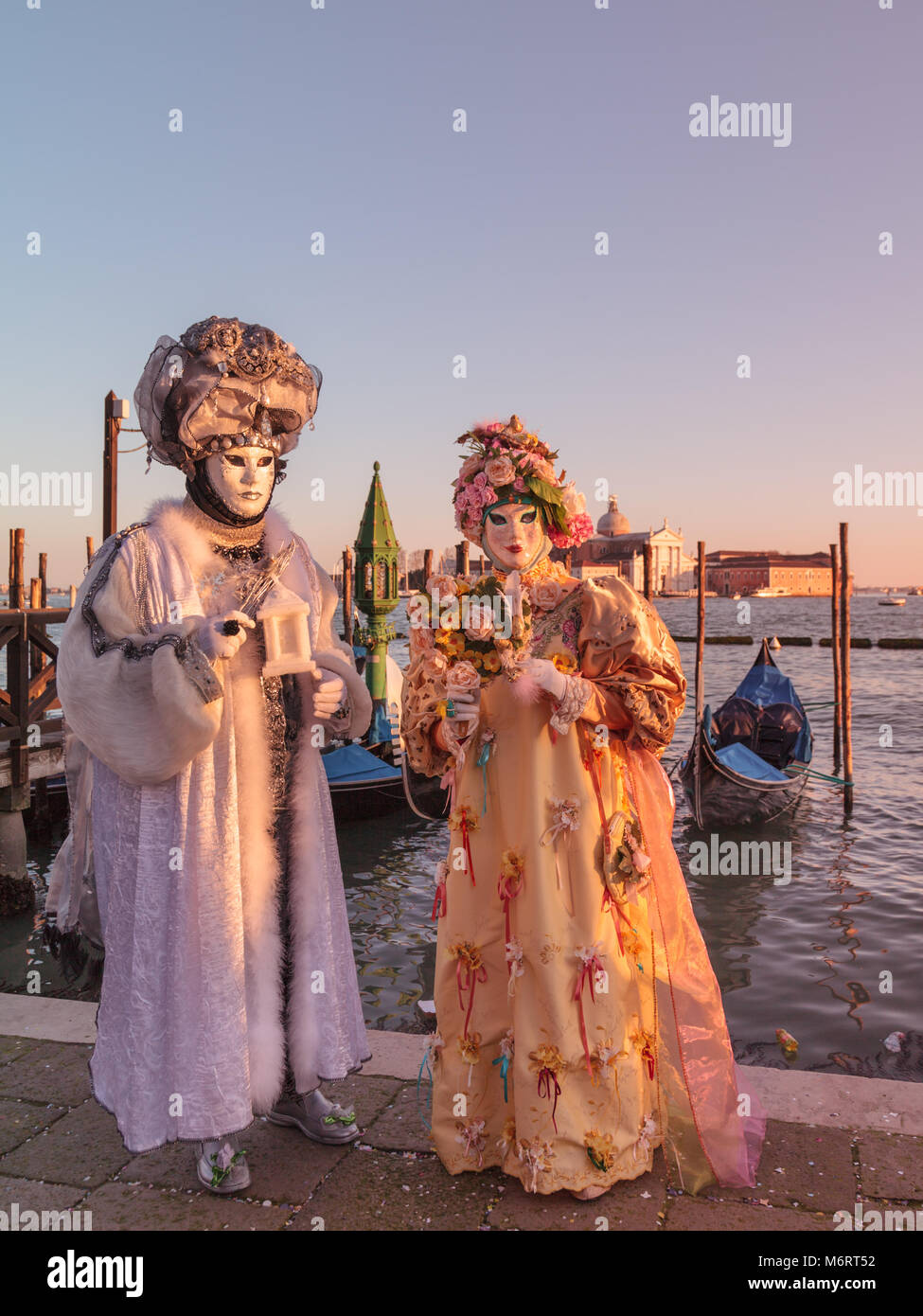 People in beautiful fancy dress costumes and mask at the Venice ...