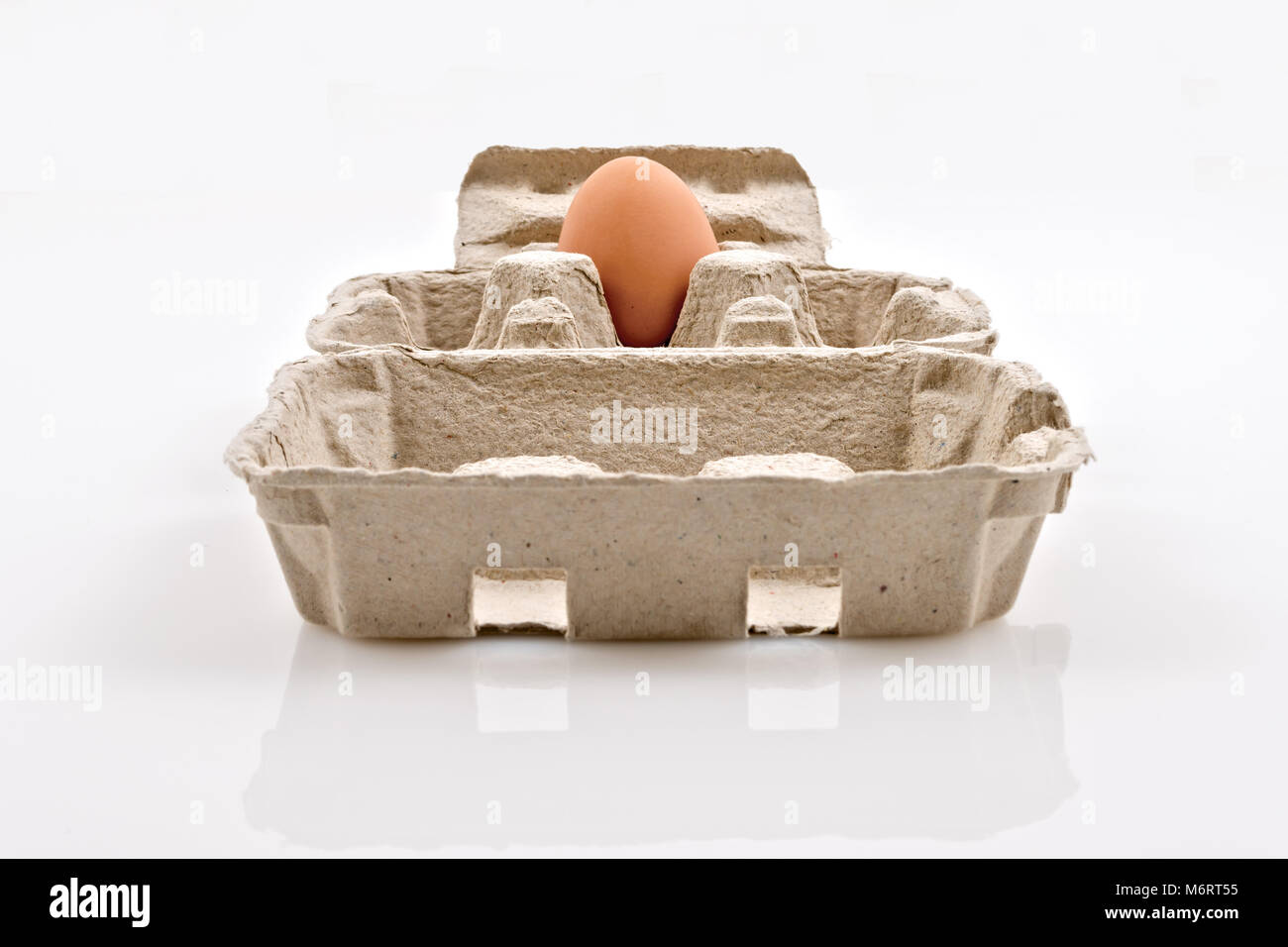 empty egg box with egg on white 7 Stock Photo - Alamy