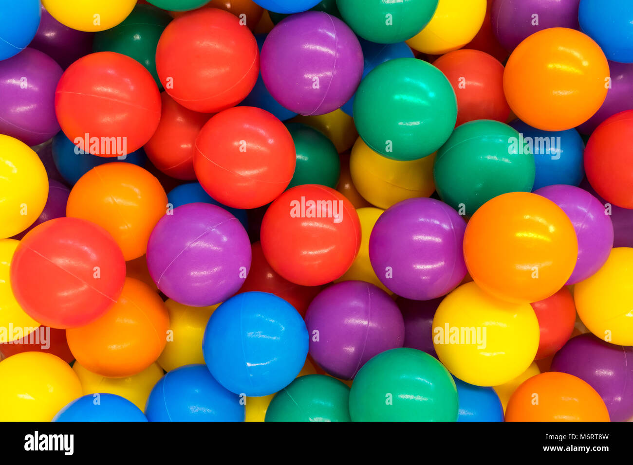 many colorful plastic balls on playground Stock Photo - Alamy