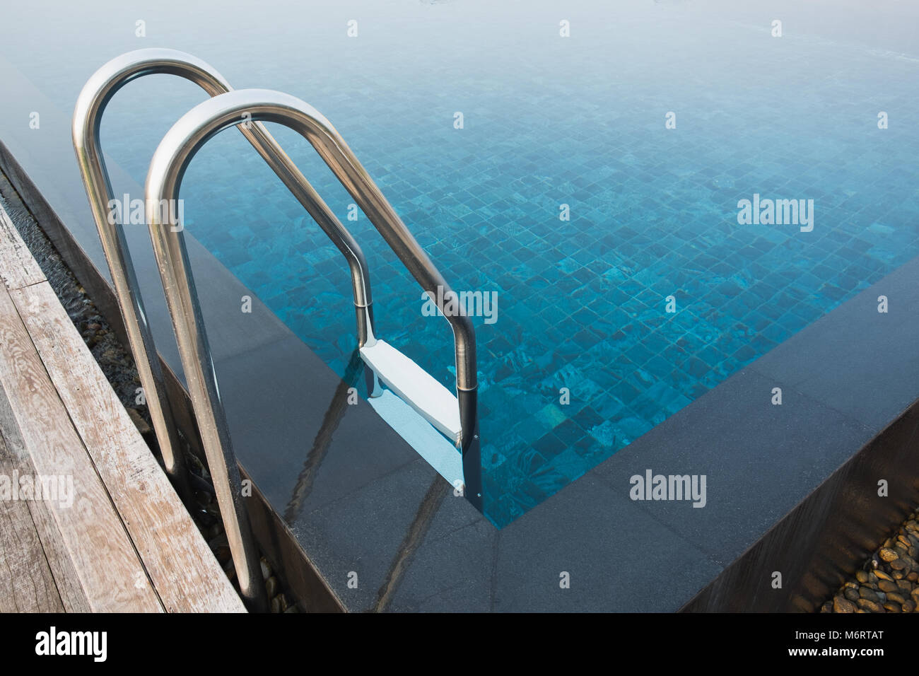 swimming pool with sunny reflections Stock Photo - Alamy