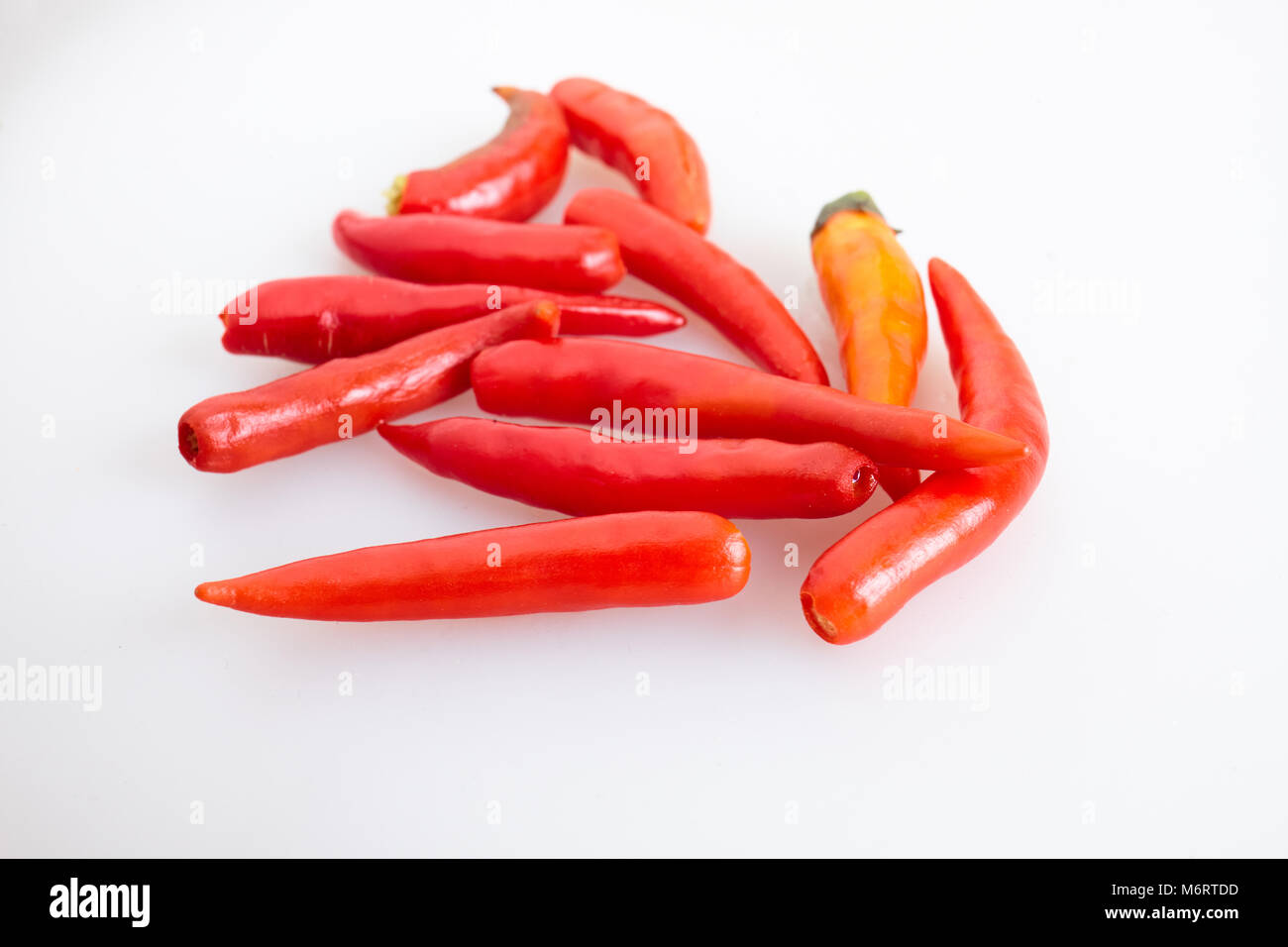 Group of red chilli peppers without stem on white background - top view ...