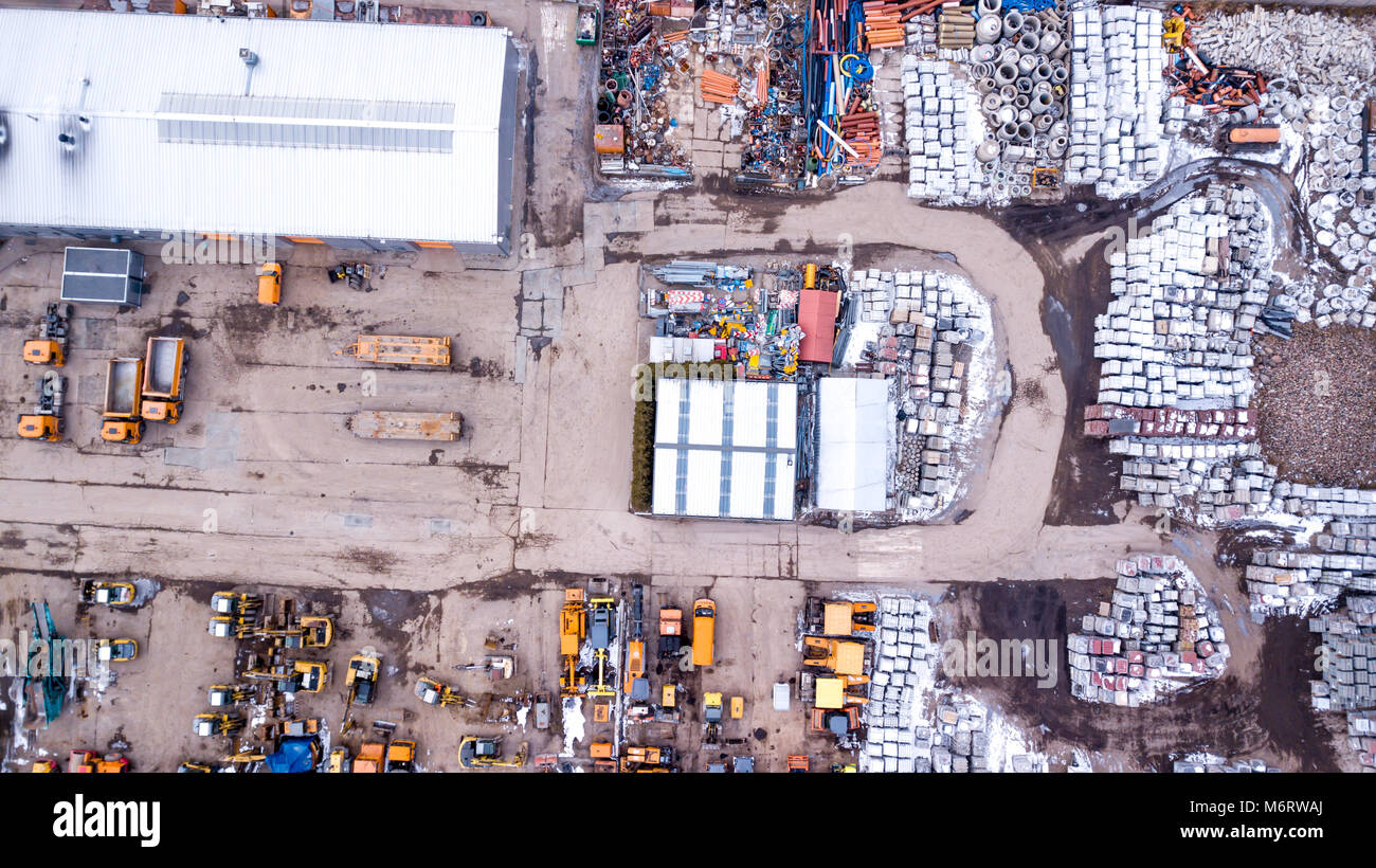 Aerial view over a workshop, factory, recycling facility, warehouse ...