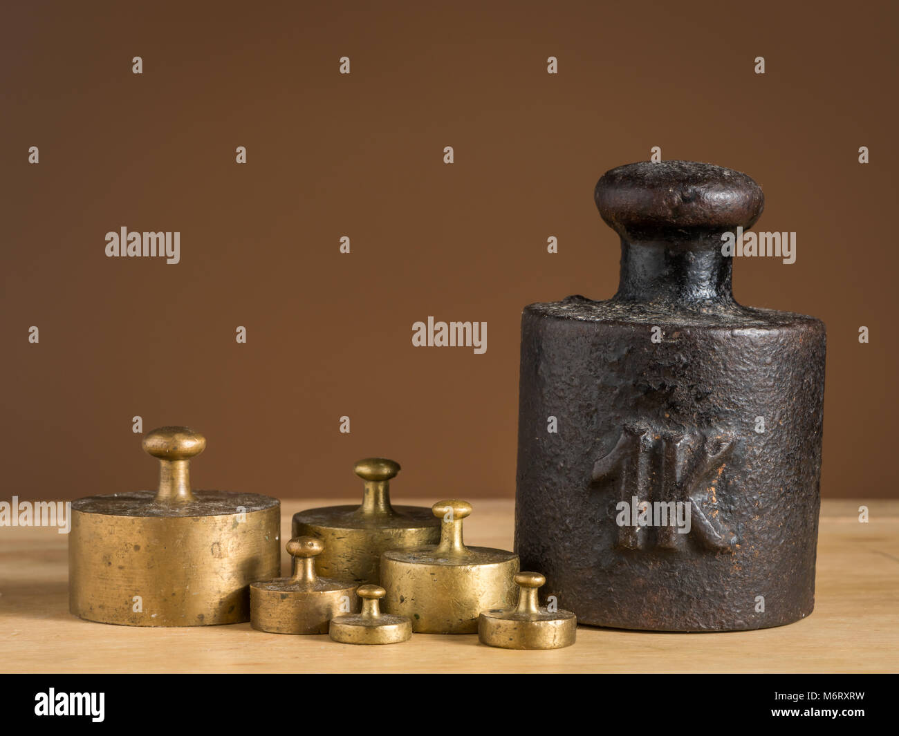 Old iron 1kg weight and smaller brass weights for a kitchen scale ...