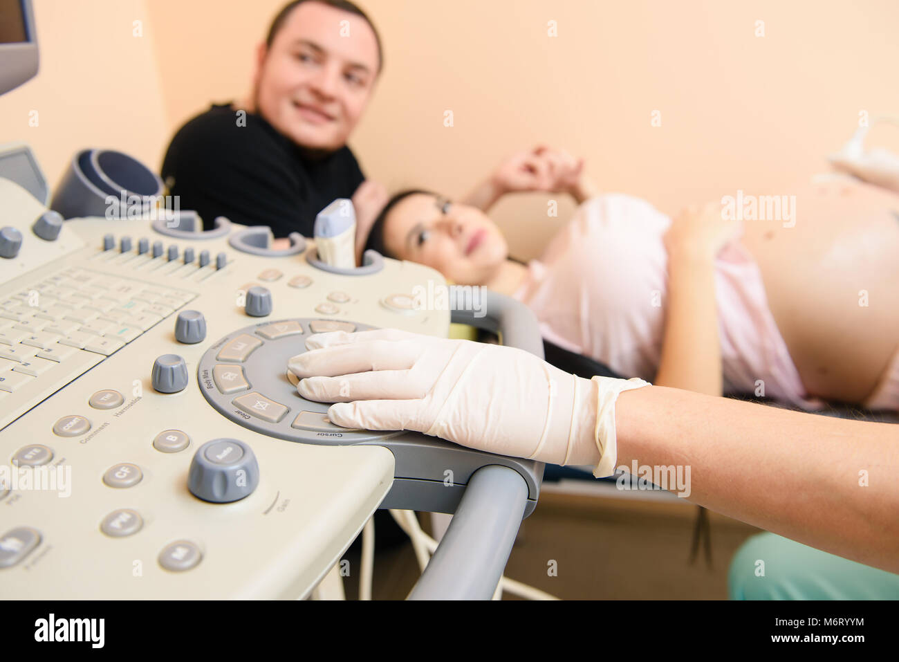 Doctor uses ultrasound scan hi-res stock photography and images - Alamy