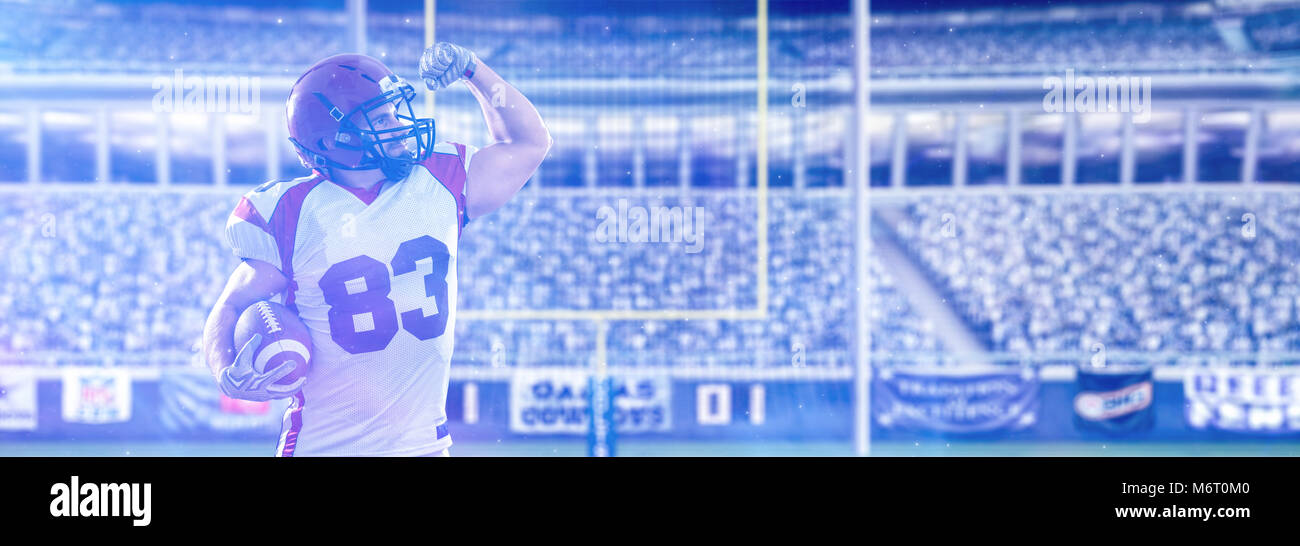 american football player celebrating touchdown on big modern stadium ...
