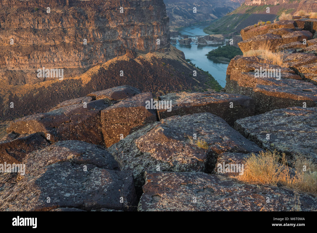 Snake River Flows in the Canyon behind large boulders Stock Photo - Alamy