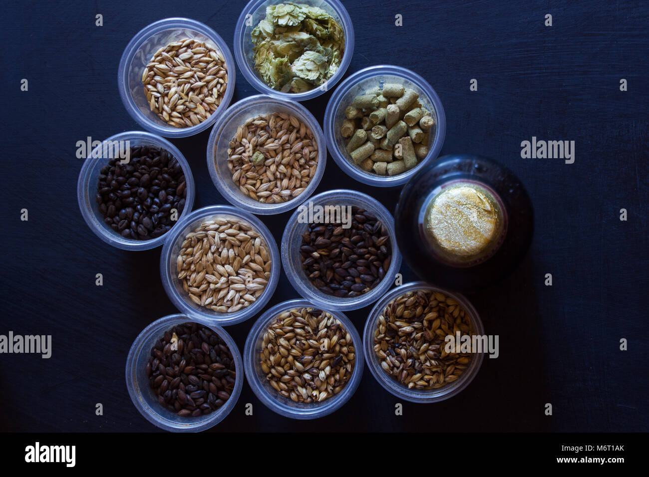 top view of beer brewing ingredients on blackboard, hop, malt, barley ...