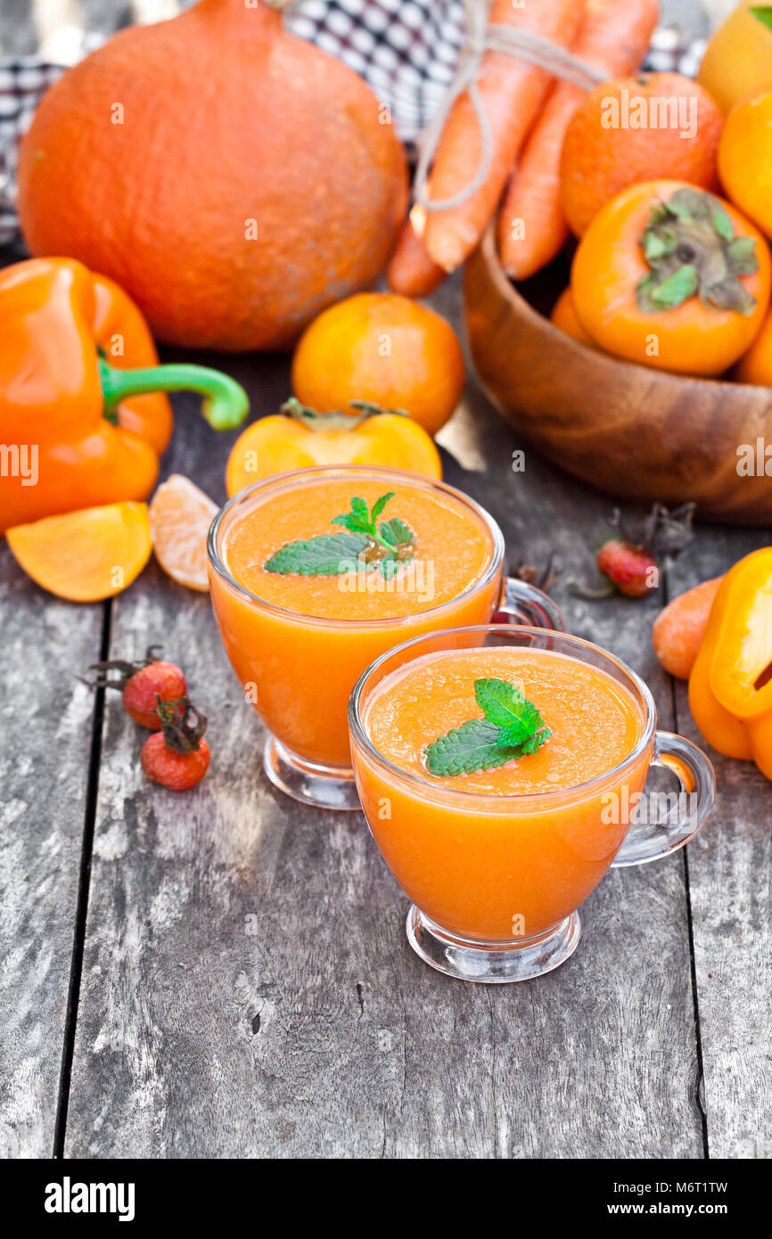 fresh healthy pulpy cocktail with orange fruits and berries and ...