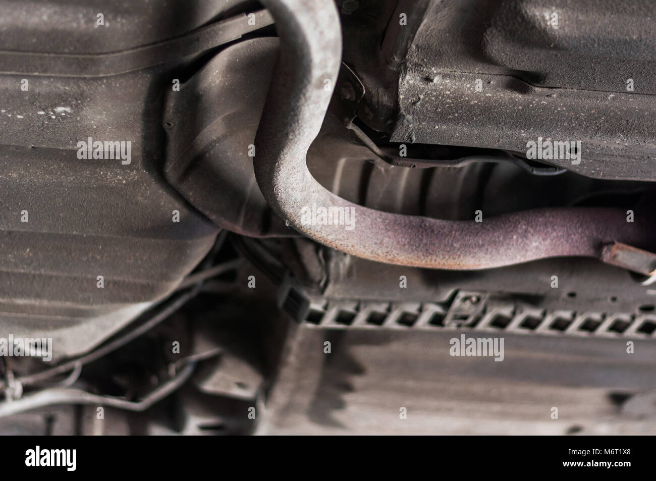 Close up pipe exhaust rusty iron under car with lift background Stock ...