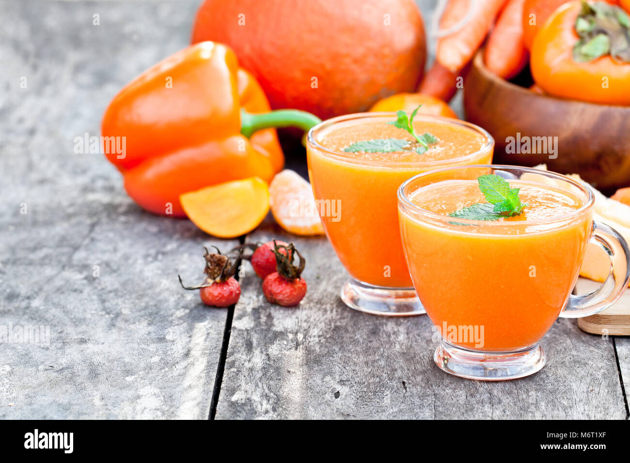 fresh healthy pulpy cocktail with orange fruits and berries and ...