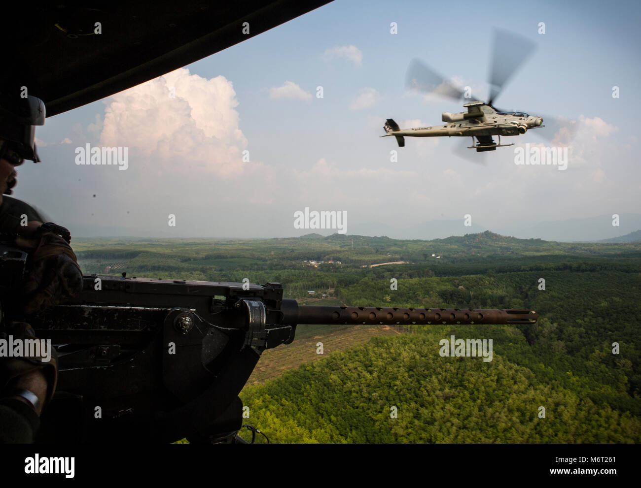 An AH-1Z Viper helicopter maneuvers towards an objective during close ...