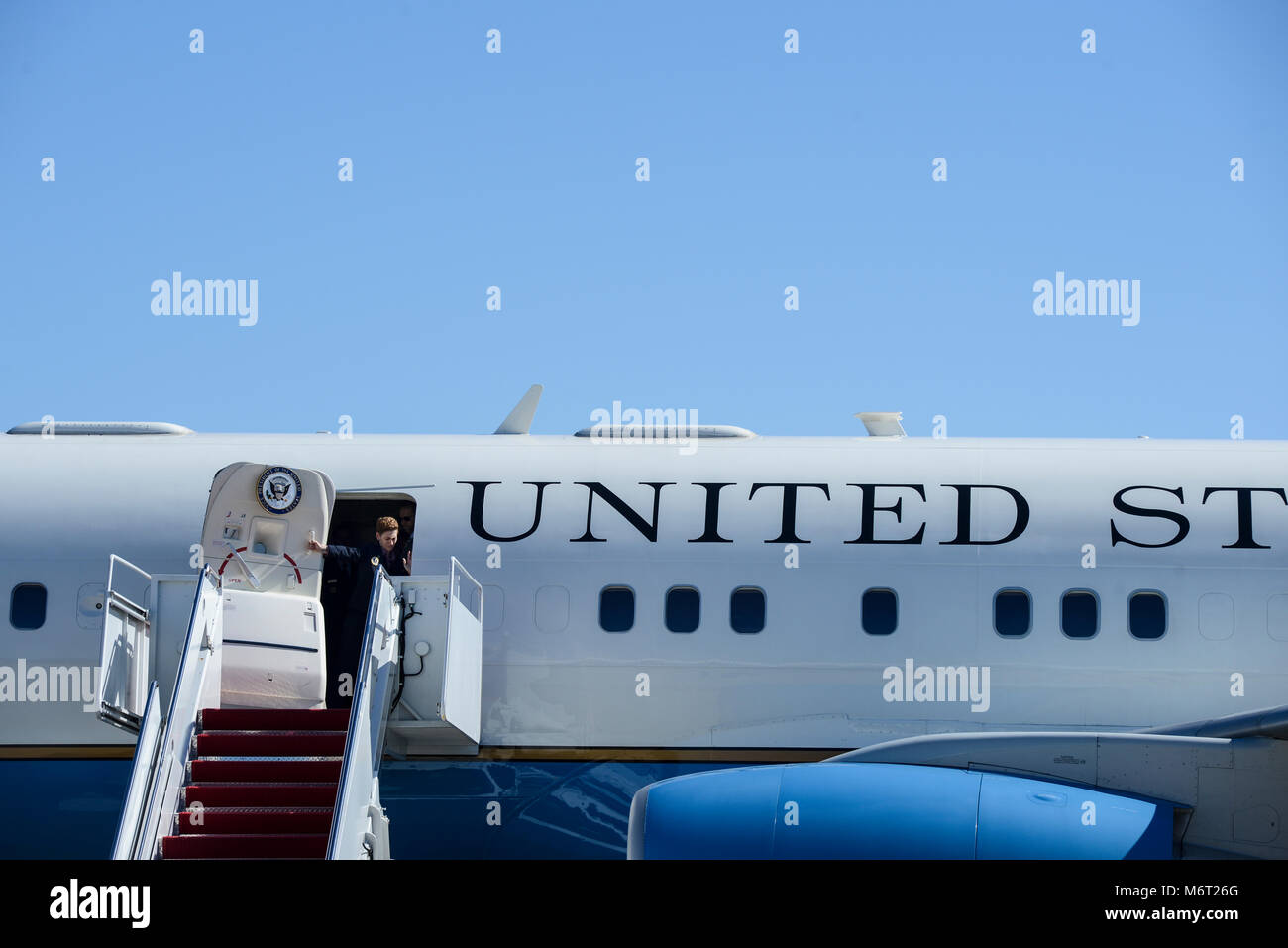 An aircrew member aboard Air Force Two prepares for departure from ...