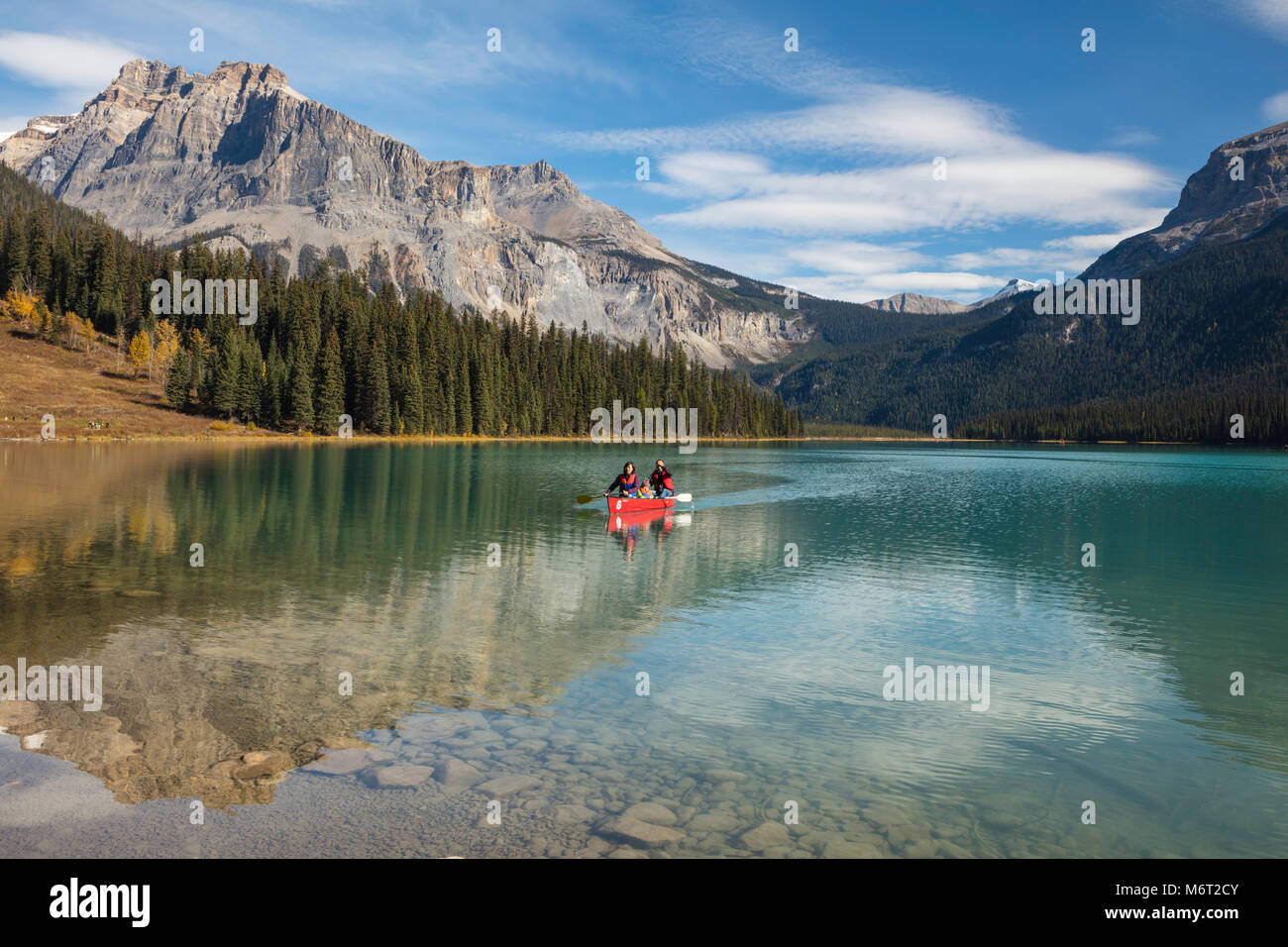 Family in a canoe on Emerald Lake, Yoho National Park, British Columbia ...