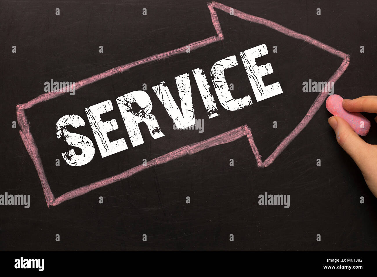 Service - female hand with chalk and arrow with text Stock Photo - Alamy