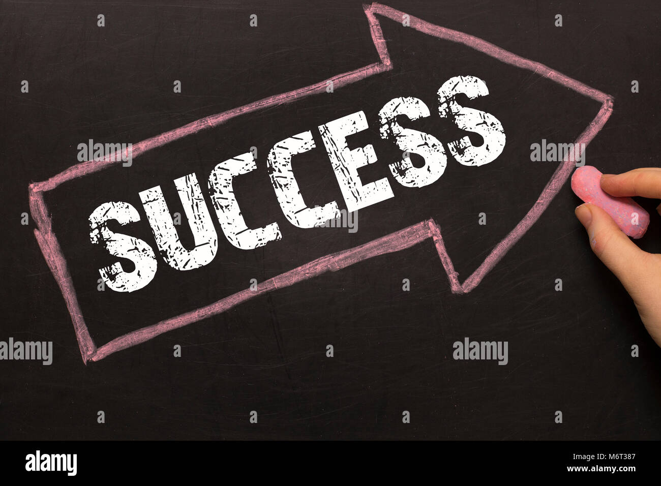 Success - Chalkboard with arrow on black background Stock Photo - Alamy