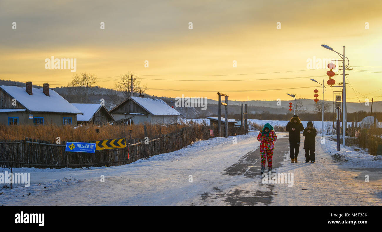 Mohe, China - Feb 19, 2017. People walking at snow village in Mohe ...