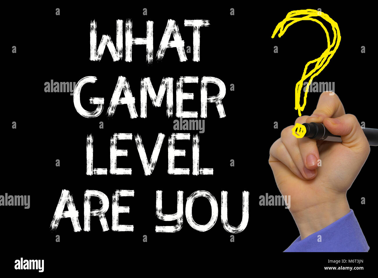 Hand writing the text: What Gamer Level Are You Stock Photo - Alamy