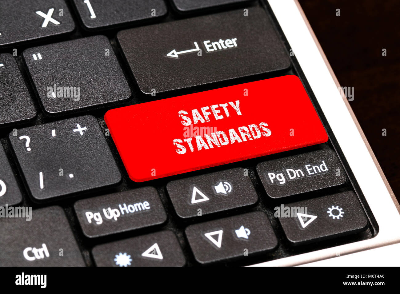 On the laptop keyboard the red button written Safety Standards Stock ...