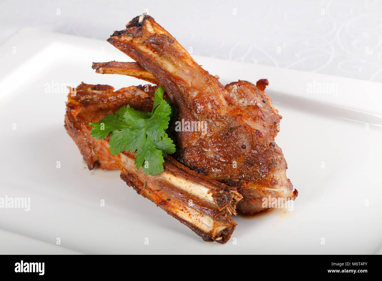 Roasted lamb with coriander leaves Stock Photo - Alamy
