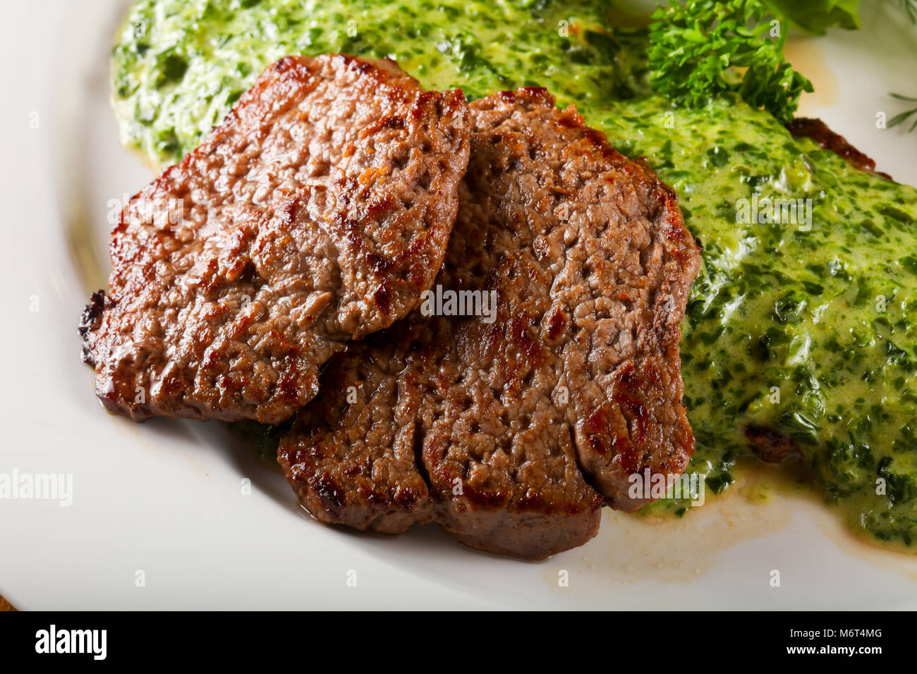 Beef with spinach mousse Stock Photo - Alamy