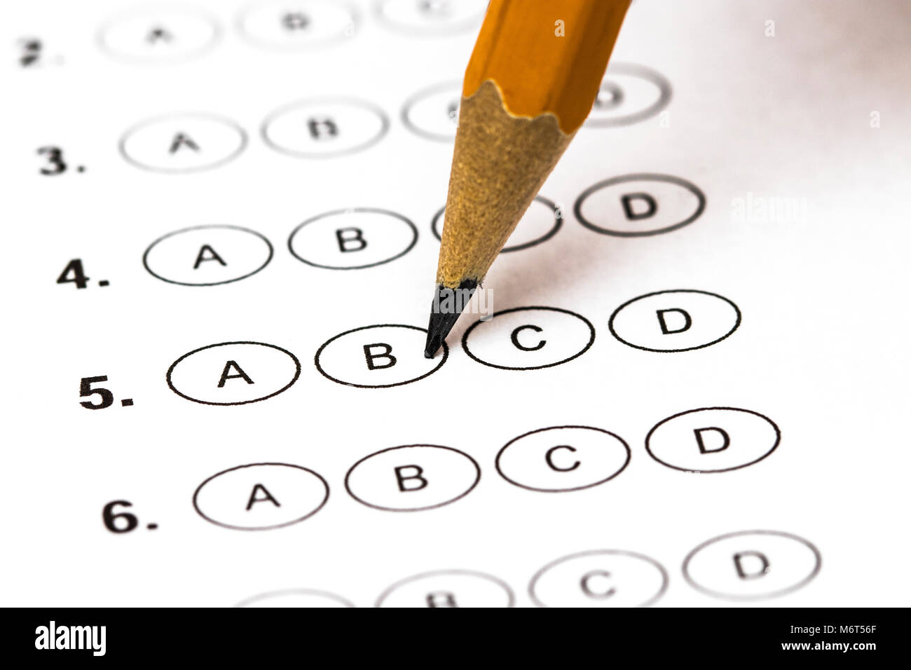 Test score sheet with answers and pencil . Closeup Stock Photo - Alamy