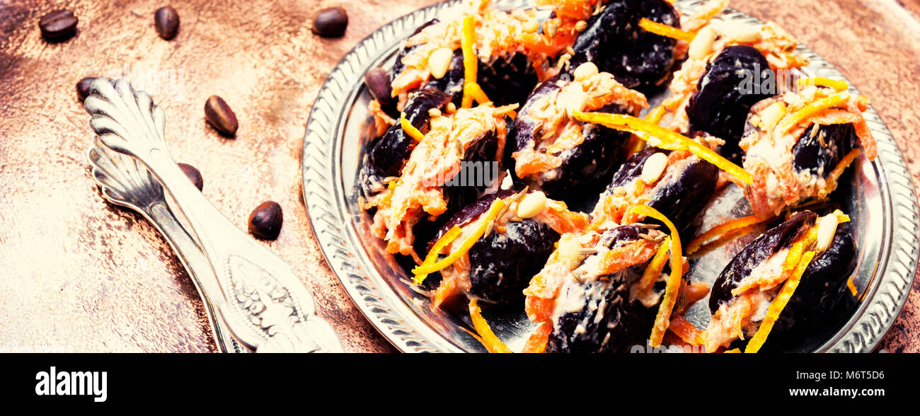 Desserts of Moldovan cuisine,prunes stuffed with nuts Stock Photo - Alamy