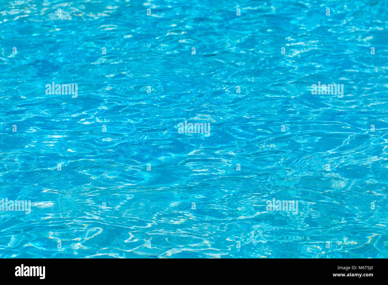 Blue water rippled background in swimming pool Stock Photo - Alamy