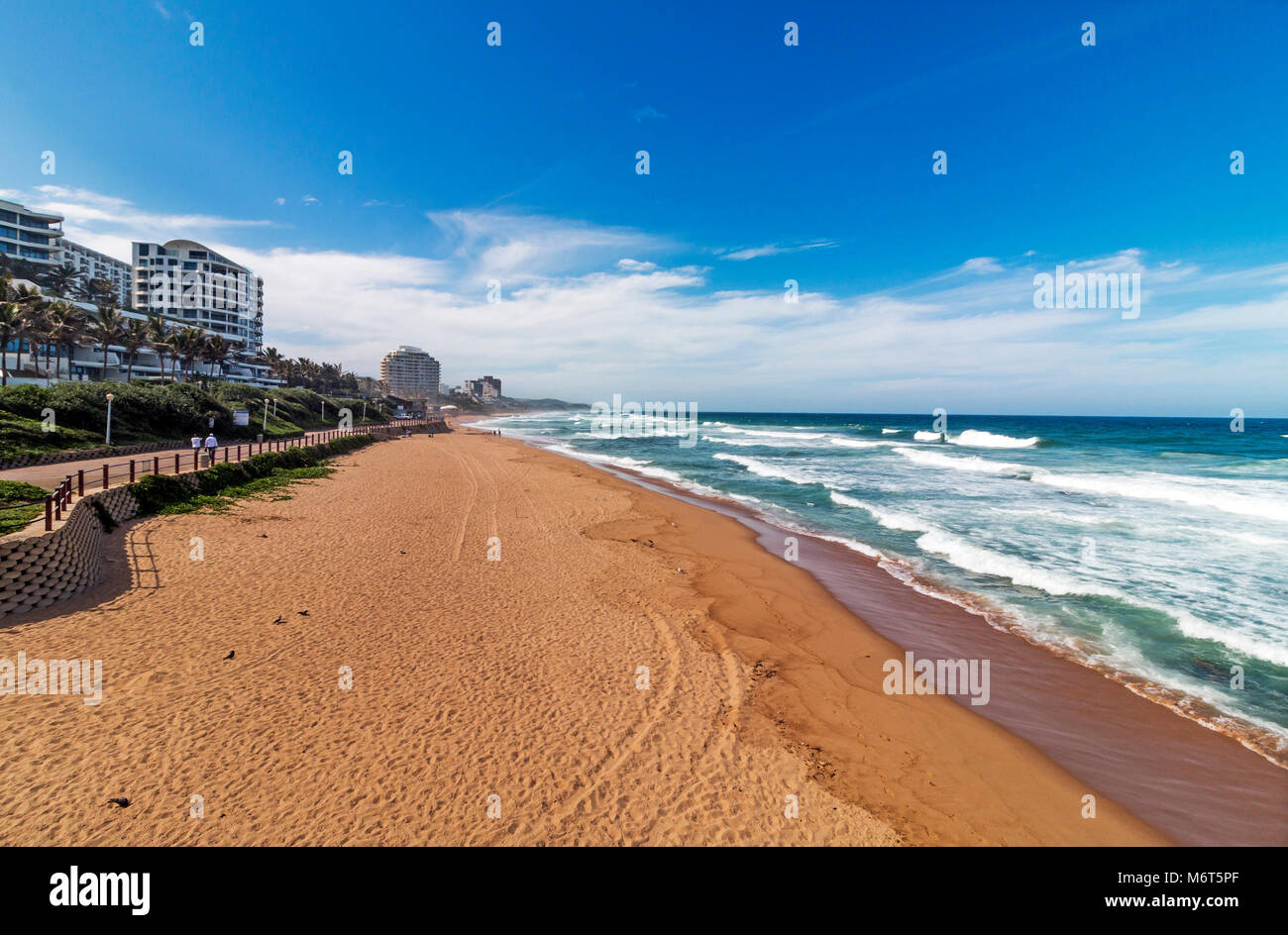 Empty Umhlanga Rocks beach and sea against blue sky coastal landscape ...
