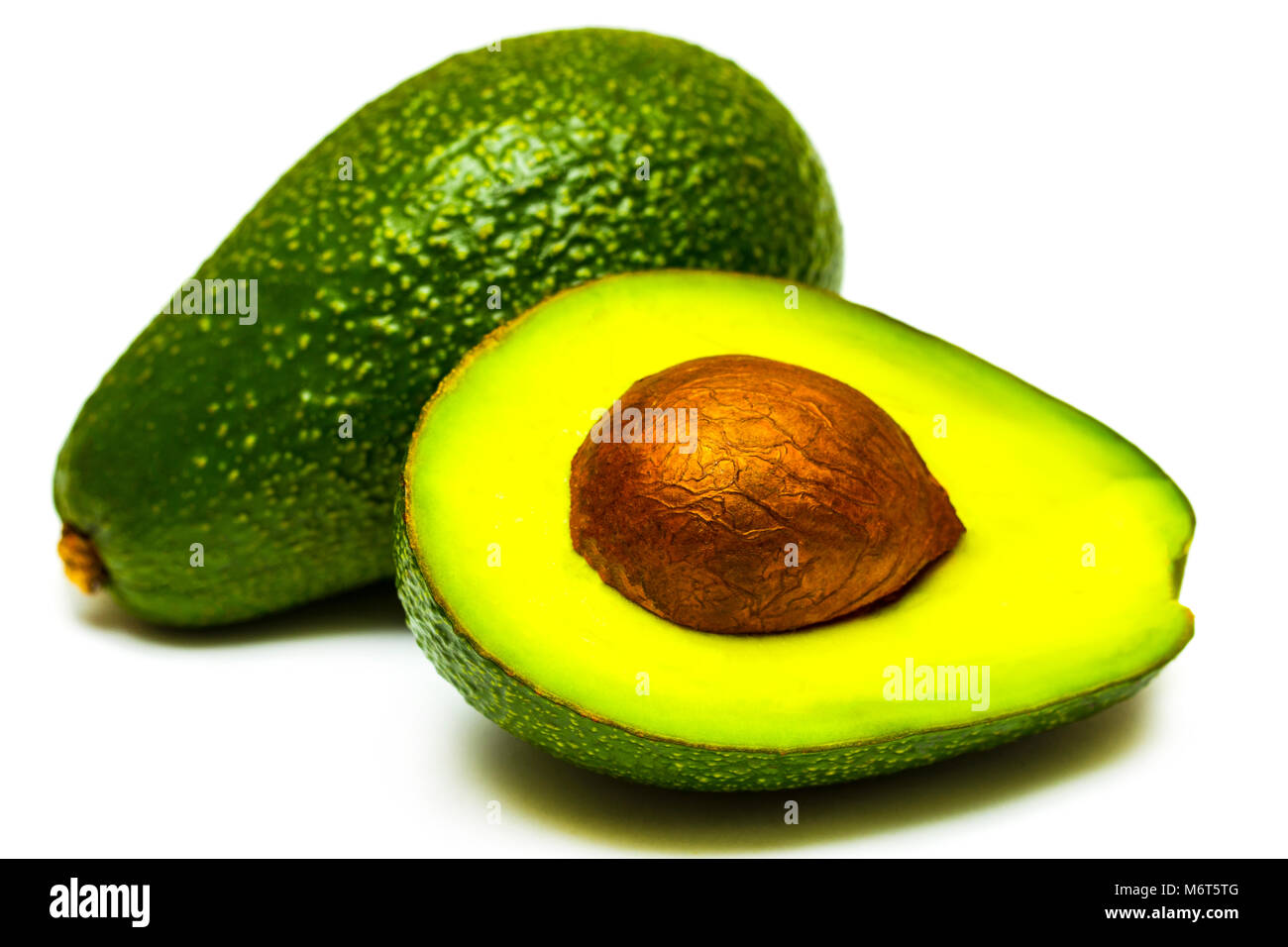 Half of fresh avocado isolated on white Stock Photo - Alamy