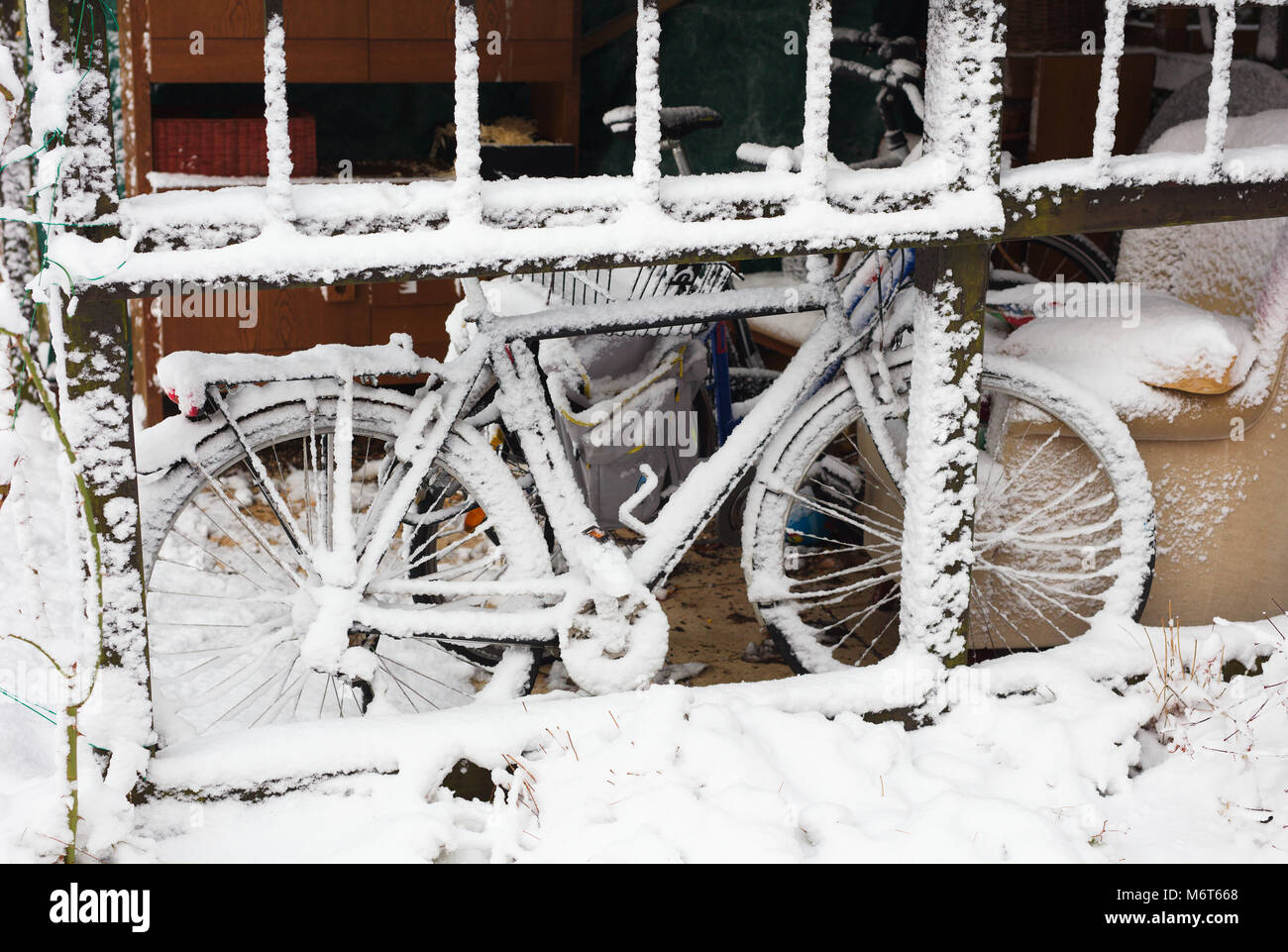 Bicycle in snow Stock Photo - Alamy
