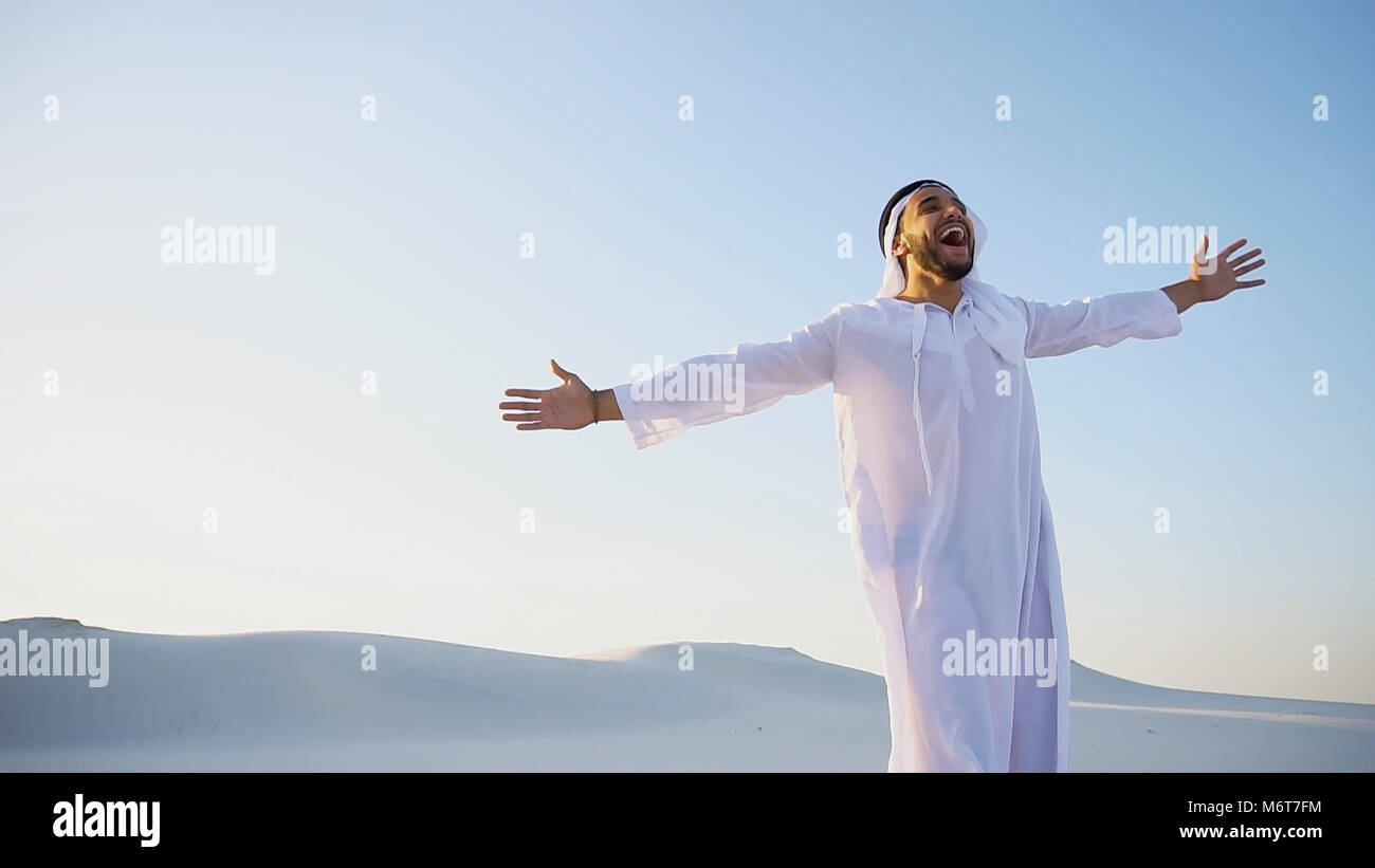 Happy Muslim man looks through banknotes and beside himself with Stock ...
