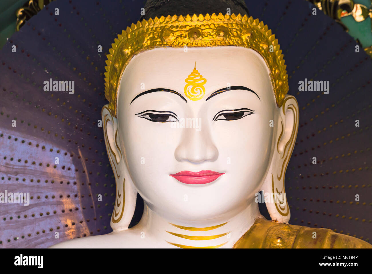 Close up detail of face of Buddha statue at Shwedagon Pagoda, Yangon ...